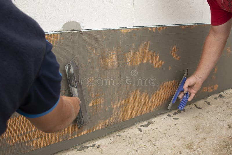 A Building Contractor is Installing a Reinforcing Mesh Stock Image ...