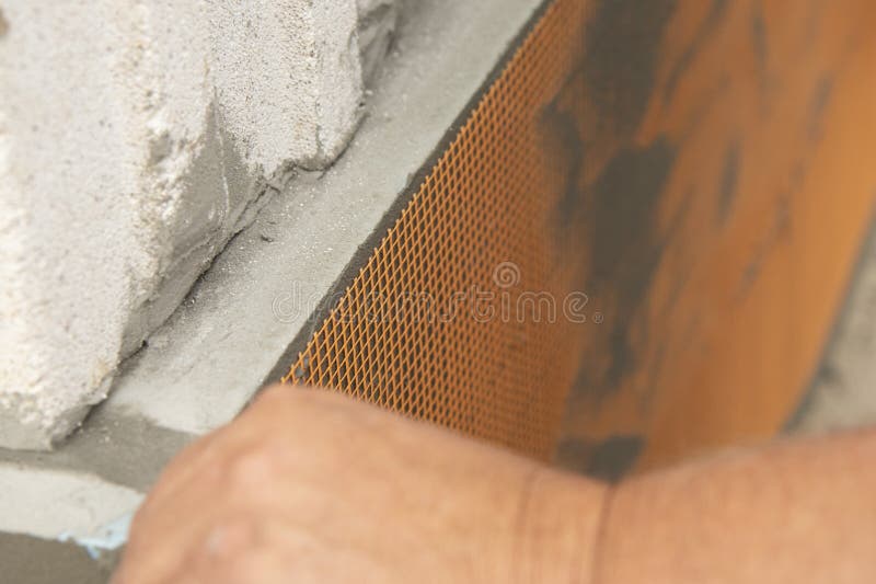 A Building Contractor is Installing a Reinforcing Mesh Stock Photo ...