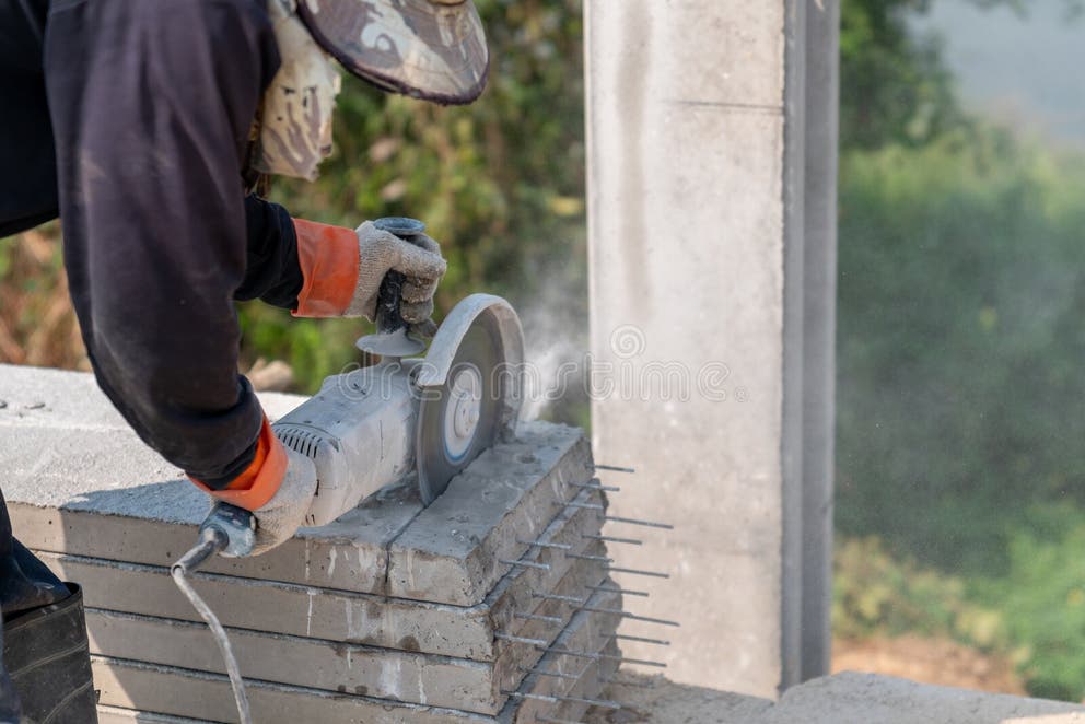 Building Contractor Using Angle Grinding To Cut Precast Concrete Slab ...