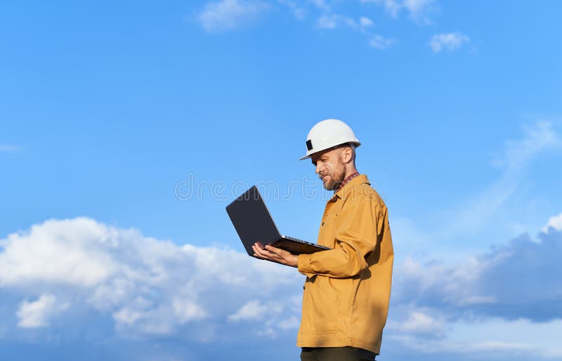Building Contractor Using Laptop at Construction Site Stock Photo ...