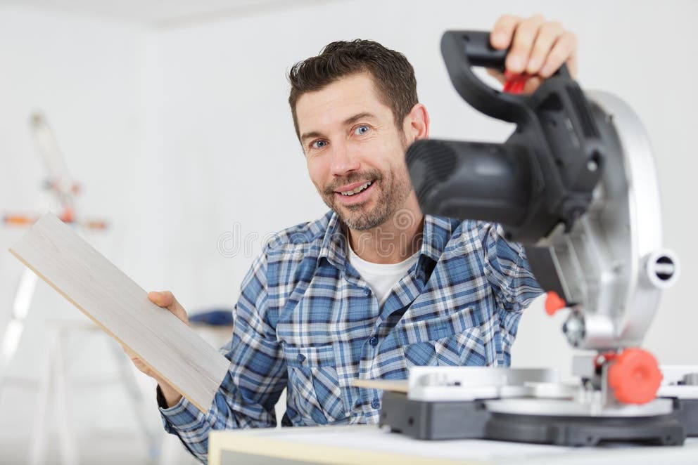 Building Contractor Worker Using Hand Held Worm Drive Circular Saw ...
