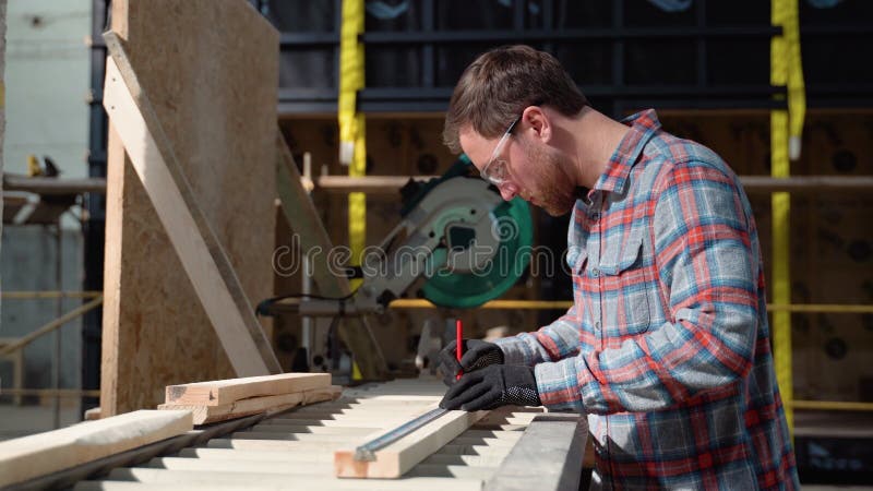 Building Contractor Worker Using Hand Held Worm Drive Circular Saw To ...