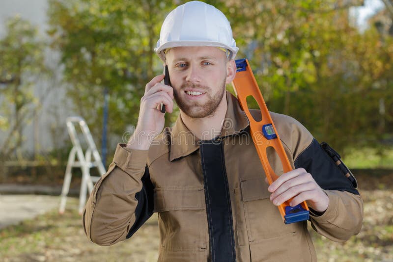 Building Contractor Working on Site Talking on Mobile Phone Stock Photo ...