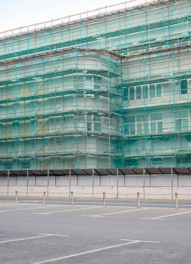 The Building is Covered with Scaffolding and Safety Netting. Stock ...