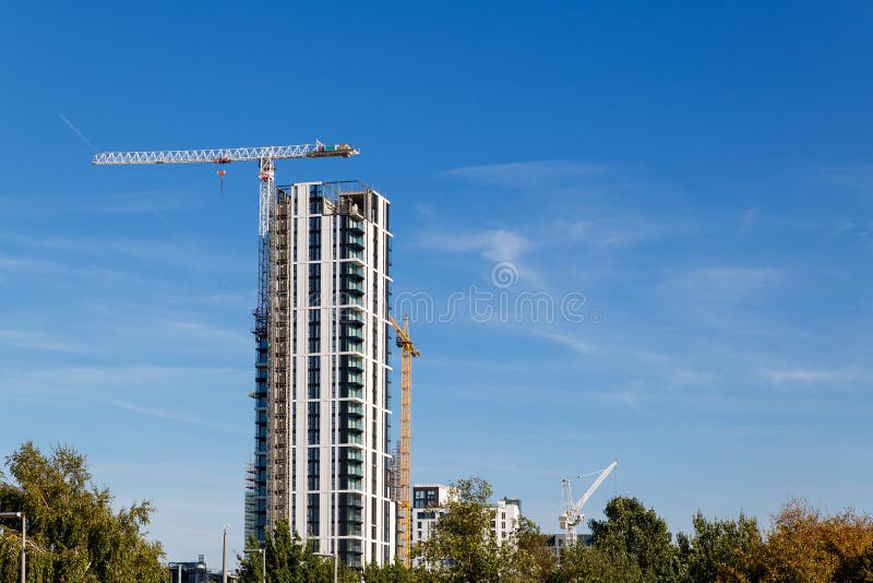 Building Crane and Construction Site Under Blue Sky. Stock Image ...