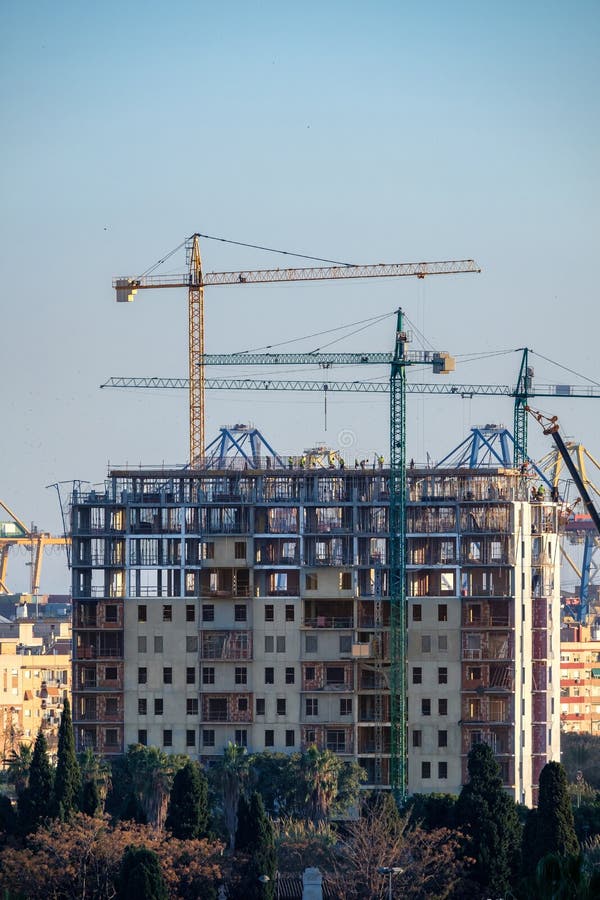 Building with cranes stock image. Image of house, built - 212291575