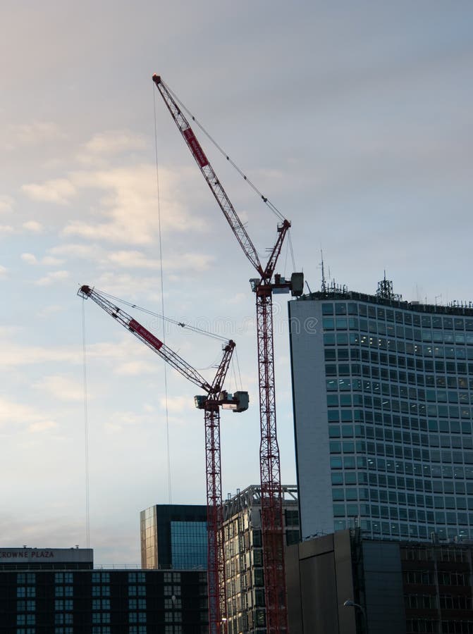 Building with Cranes, Crane on the Blue Background Editorial Photo ...