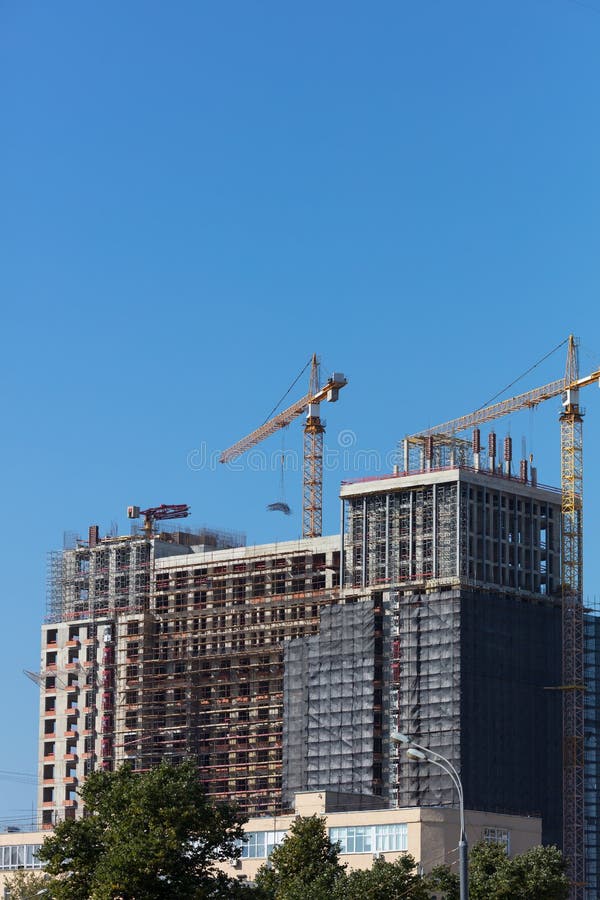 Building with Cranes stock image. Image of concrete - 100515231