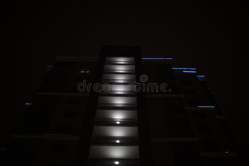 Building is in Dark with Lighting. Balconies in Row Stock Photo - Image ...