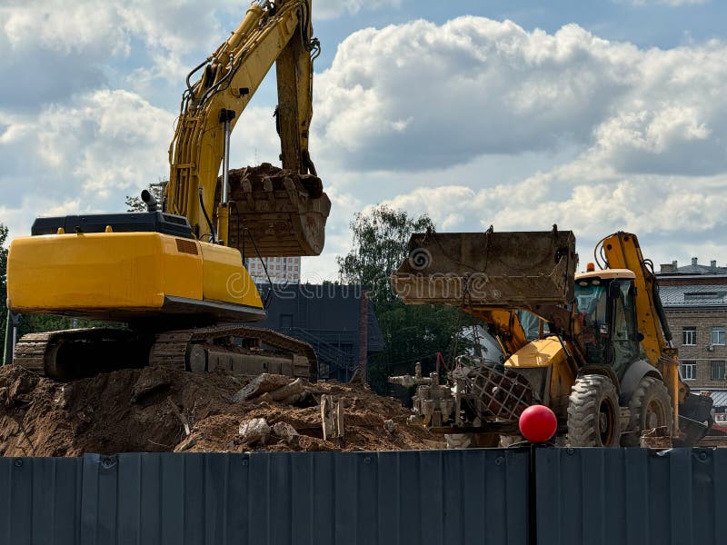 Building Destruction, Demolition of a Building by an Yellow Excavators ...