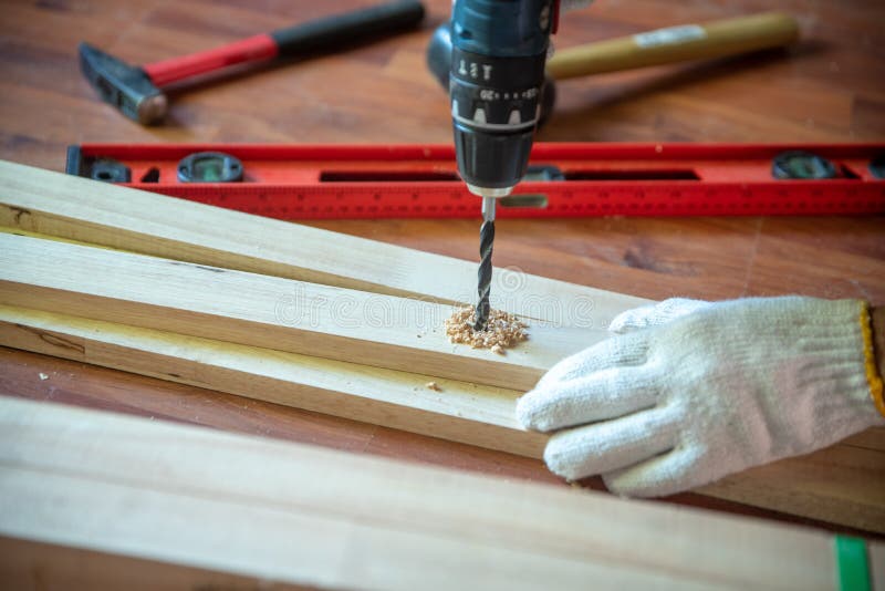 Building DIY with Drilling Machine. Professional Carpenter Working with ...