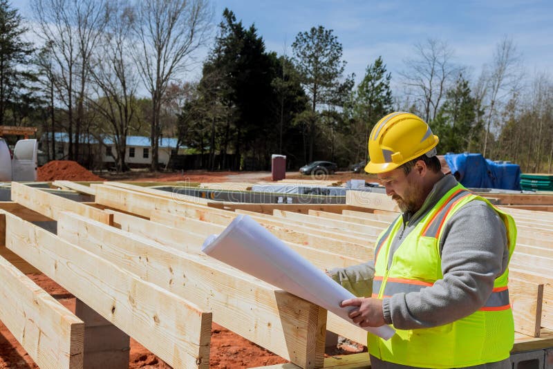 Building Engineer with Extensive Experience Holding in His Hands a ...