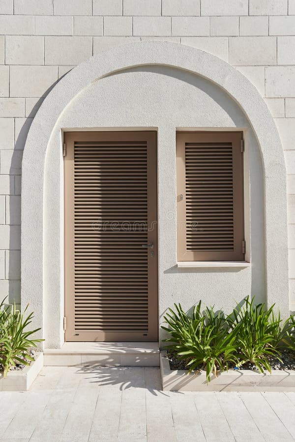 Building Entrance with Shutter Doors and Window Stock Image - Image of ...