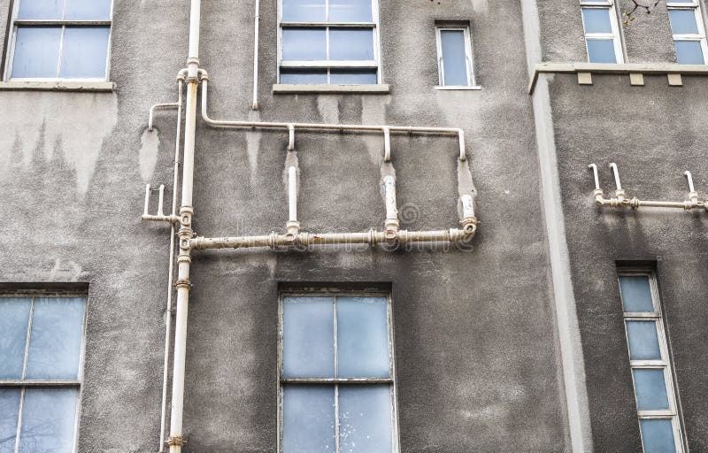 Building Facade with External Pipes Stock Image - Image of exterior ...