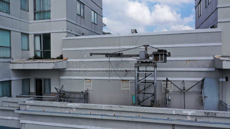 Building Facade Maintenance System. on the Roof Stock Image - Image of ...
