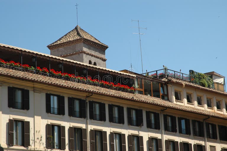 Facade with Multiple Windows and Red Geraniums on Top Stock Image ...