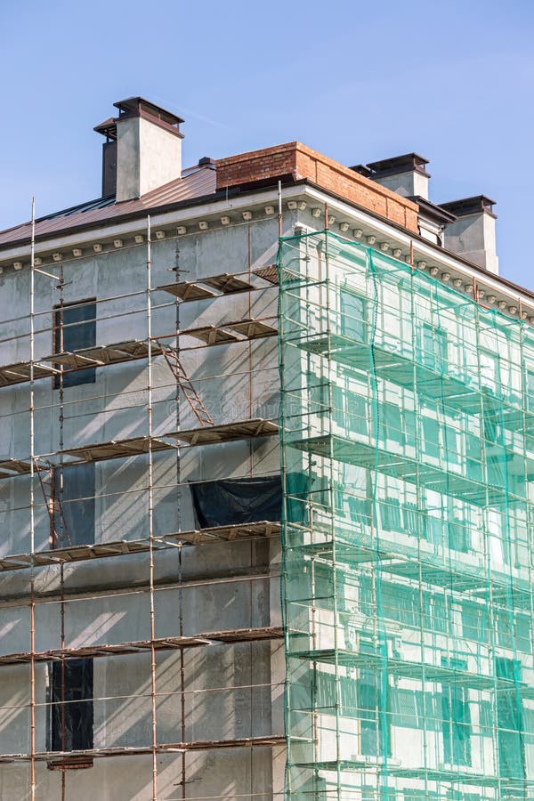 Building Facade with Scaffolding and Protective Mesh Stock Image ...