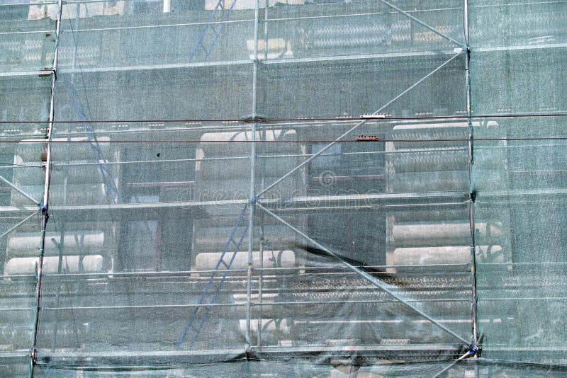 Building Facade Under Renovation Works with Construction Scaffolding ...