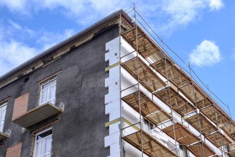 Building Facade Under Renovation Works with Construction Scaffolding ...