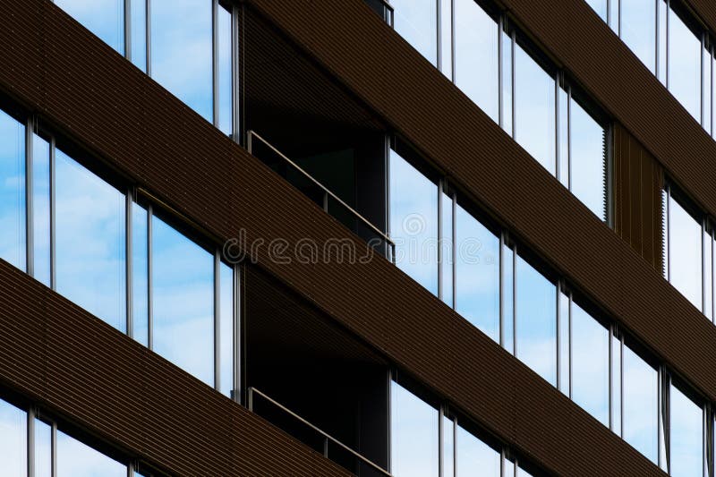 Brown Facade with Narrow Horizontal Panels and Reflective Glass Stock ...