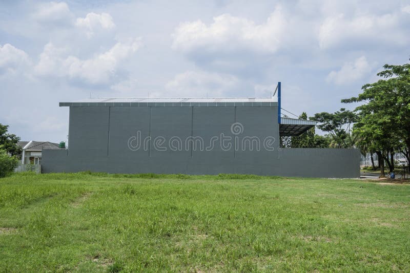 Building beside the field stock image. Image of green - 298722107
