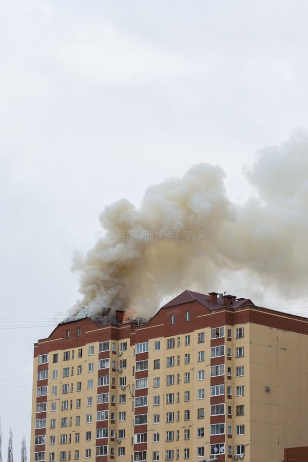 Column of Black Smoke Rising Above Residential Buildings. Stock Photo ...