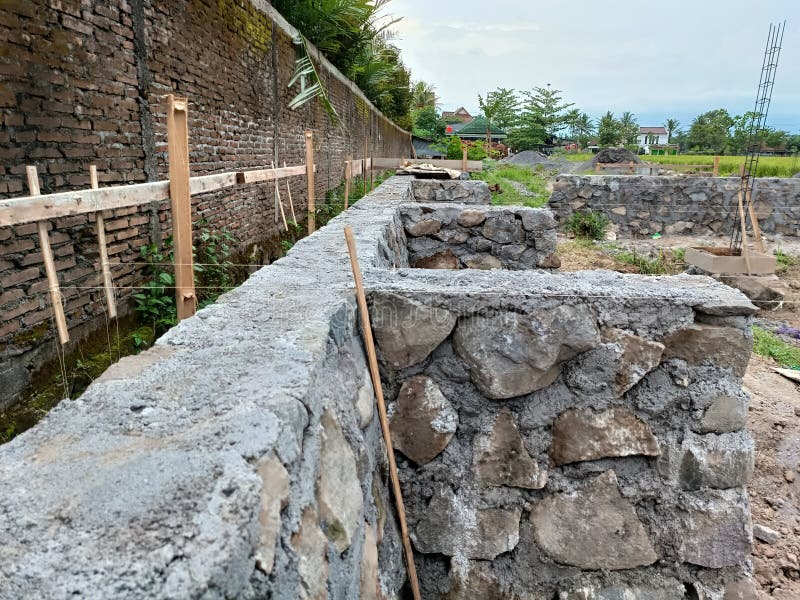 Building the Fodation with Stone and Cement , To Make the Building ...