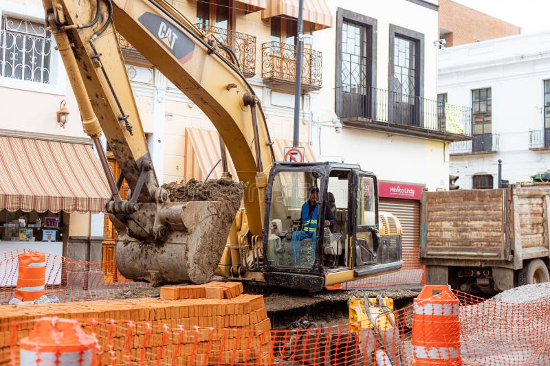 Excavation Expertise: Skilled Worker Operating Mechanical Digger ...