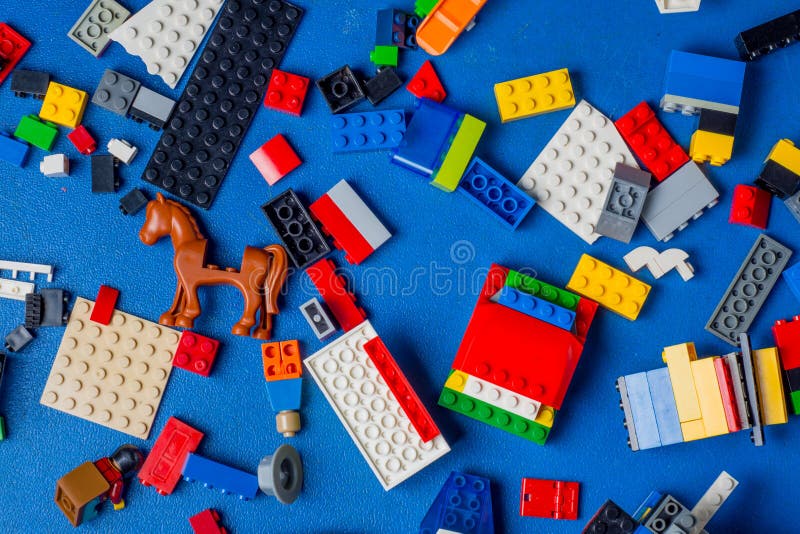 Building Game with Colorful Plastic Bricks, Laid Out on a Blue Table ...