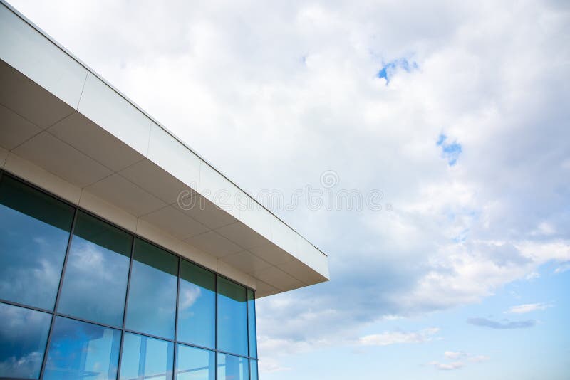 The Building with Glass Windows Reflects the Blue Sky Stock Image ...