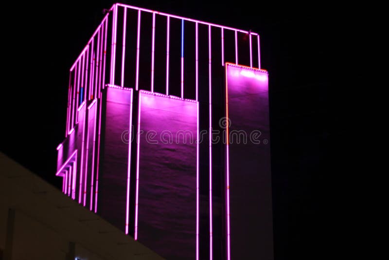 A Building Glowing with Lights at Night Stock Photo - Image of blue ...