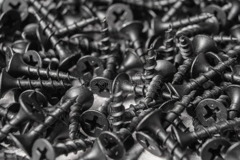Building Hardware Background. Pile of Self Tapping Black Screws. Close ...