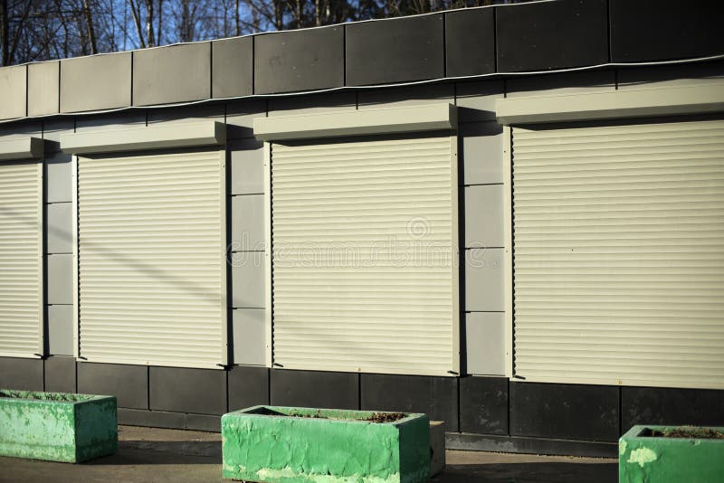Building Has Closed Windows. Shutters on Store Stock Photo - Image of ...