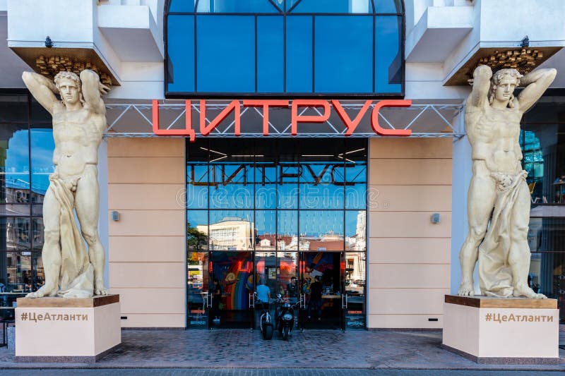 The Building Has Two Statues of Men on Either Side of the Entrance ...