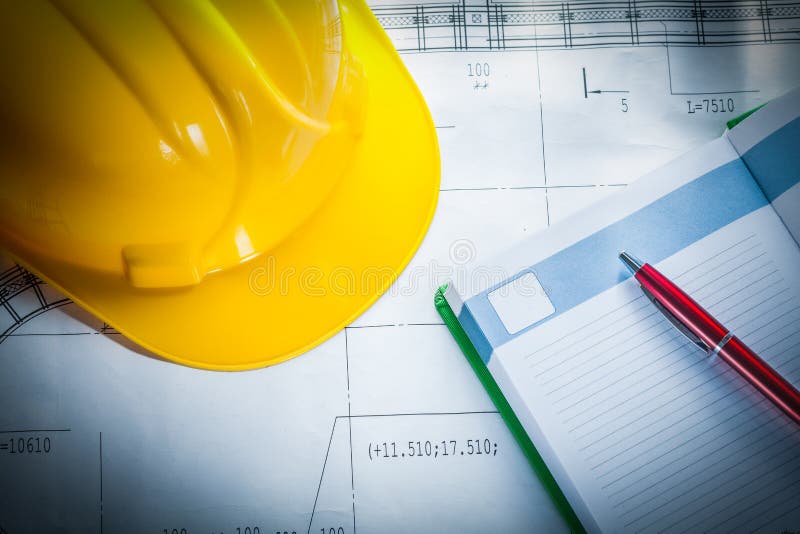 Building Helmet Notepad Pen on Blueprint Stock Image - Image of writing ...