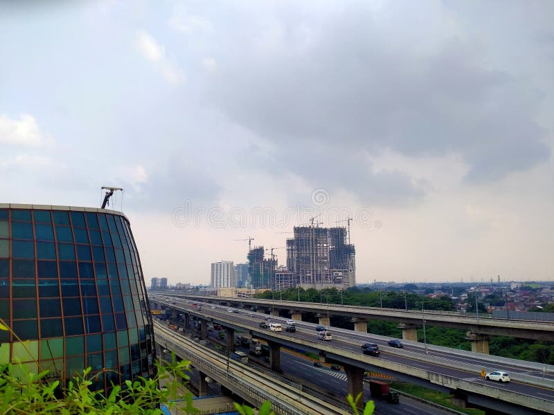 Building beside the Highway Stock Photo - Image of vehicle, skyline ...