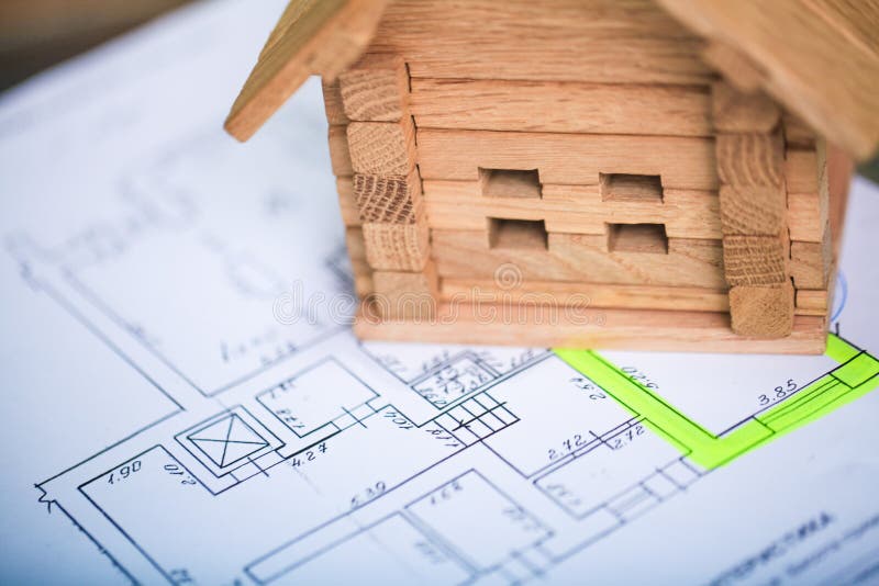 Building House on Blueprints with Plan - Construction Project Stock ...