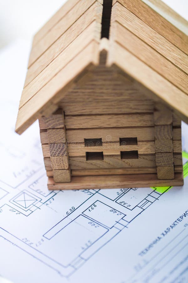 Building House on Blueprints with Plan - Construction Project Stock ...