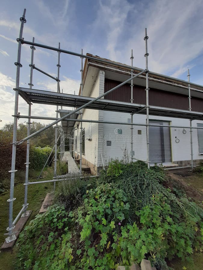 Building a House Out of Bricks Stock Image - Image of beards, clogging ...