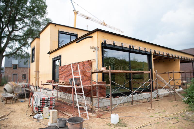 Building a House Supporting Structure for Laying Bricks Around a Wooden ...