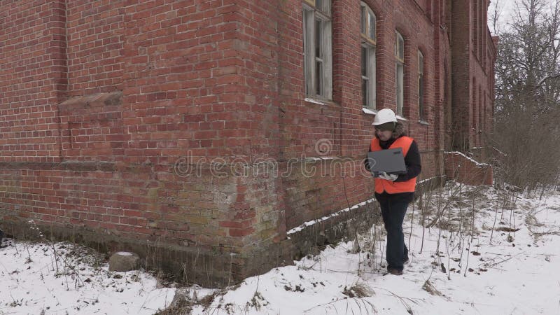 Building Inspector with Laptop Checking Old Building Stock Footage ...