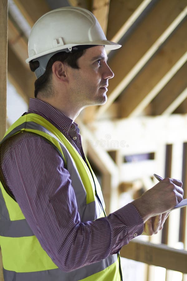Building Inspector Looking at New Property Stock Photo - Image of ...