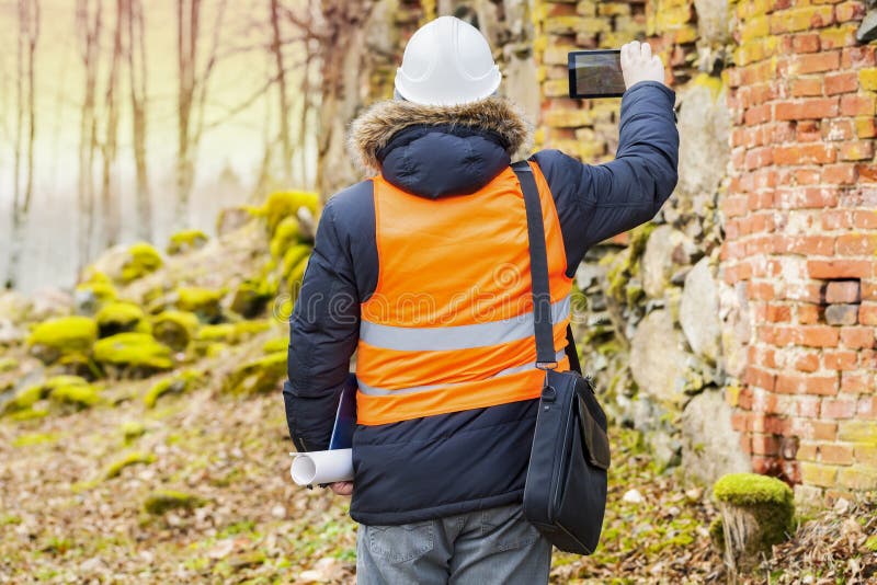 Building Inspector with Tablet PC and Documentation at Old Ruins Stock ...