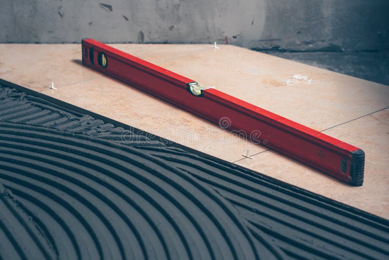 Building Level on Floor Tiles Stock Image - Image of building, flooring ...