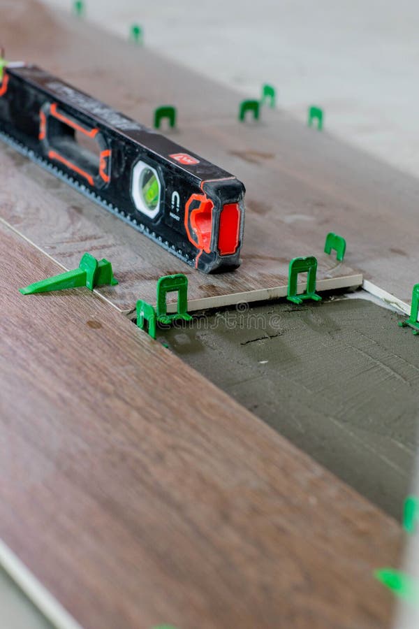 Building Level and Tile Clips for Lying on the Floor Stock Photo ...