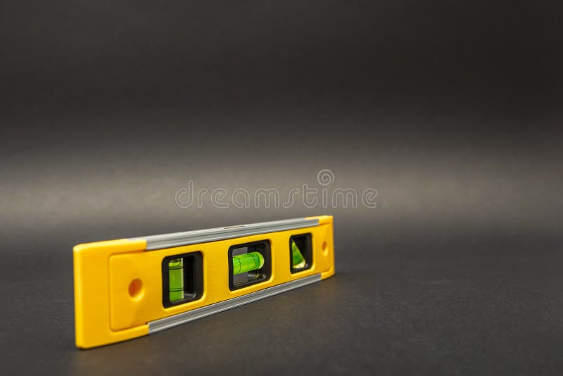 Building Level in Yellow on a Black Background. Construction Tool ...
