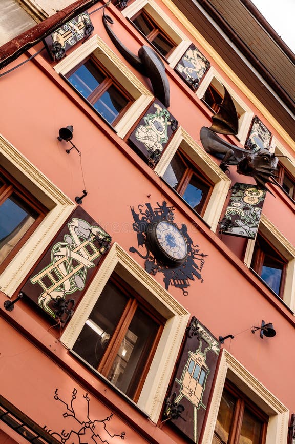 A Building with a Lot of Windows and a Clock on the Front Stock Image ...