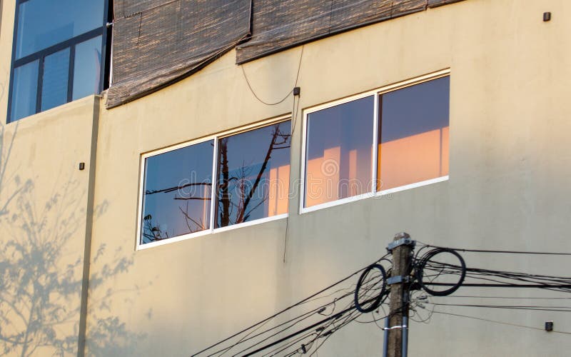 A Building with a Lot of Windows and a Wire on the Side Stock Image ...