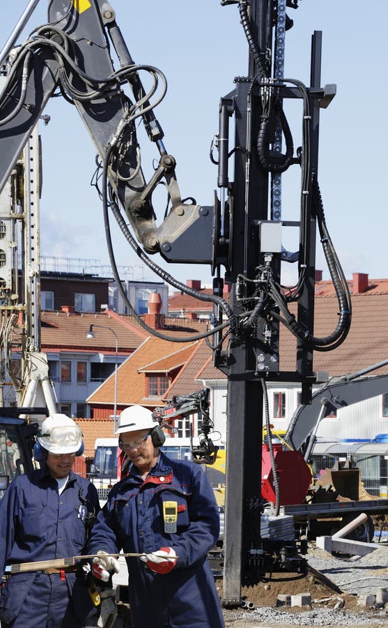 Building Machinery and Workers Stock Photo - Image of construction ...