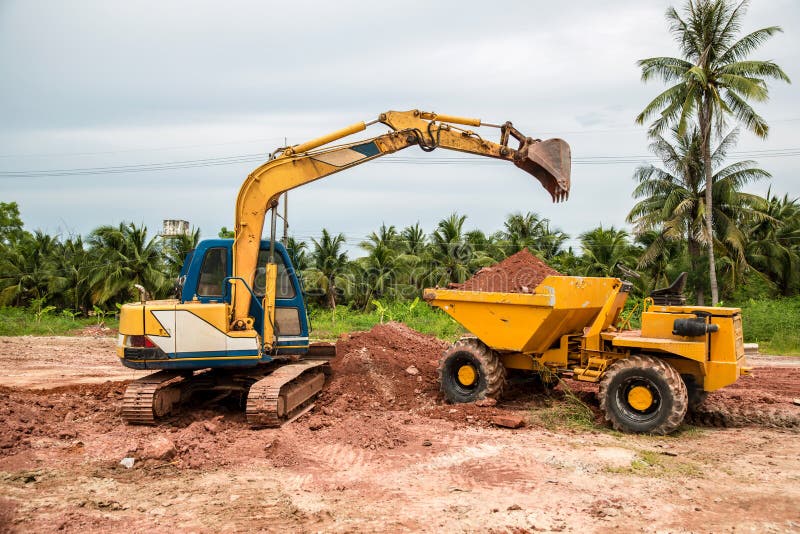 Building Machines: Digger Loading Trucks with Soil. Excavator Loading ...